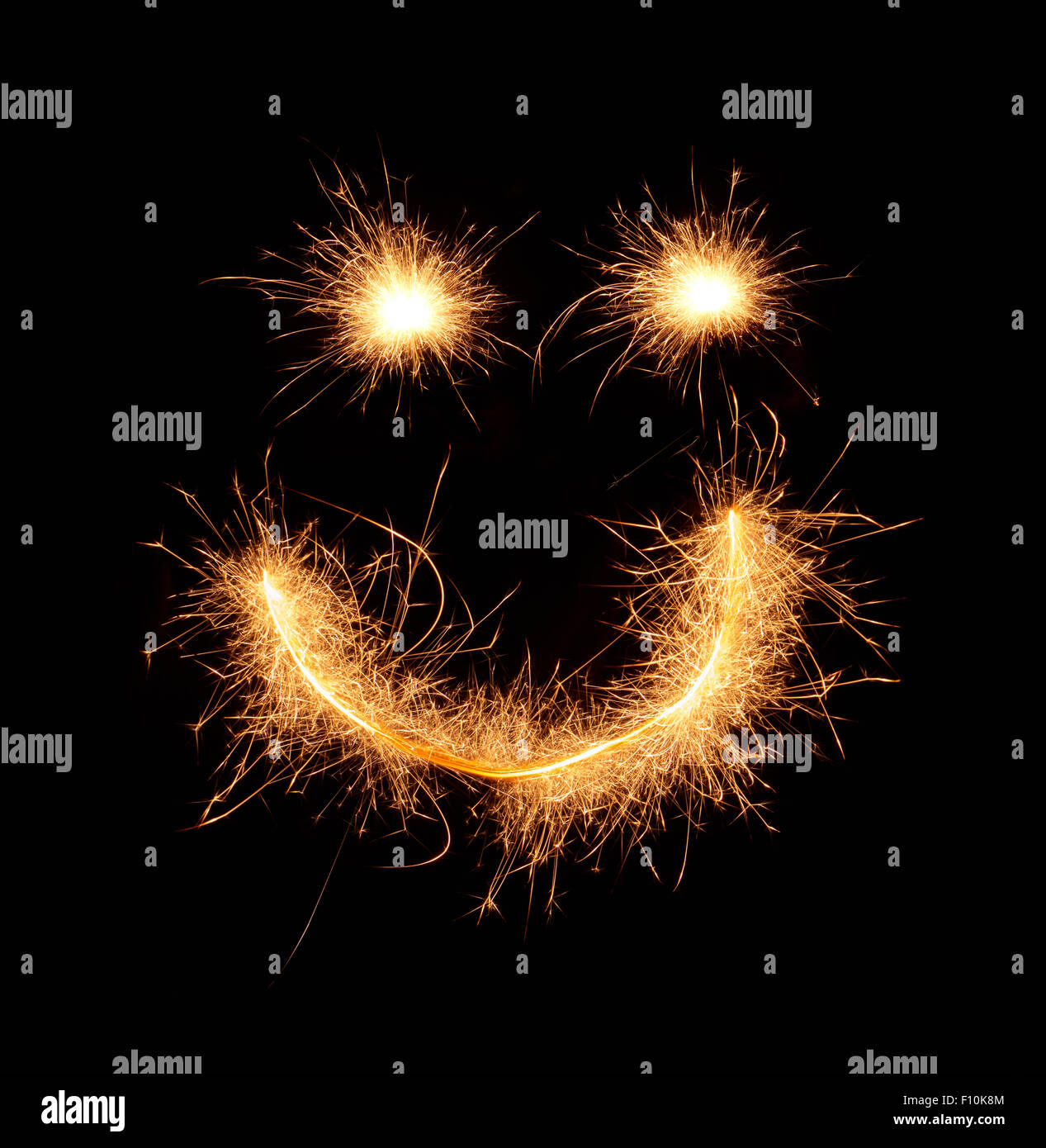 Happy weird smiling smiley drawn with sparkles isolated on black ...