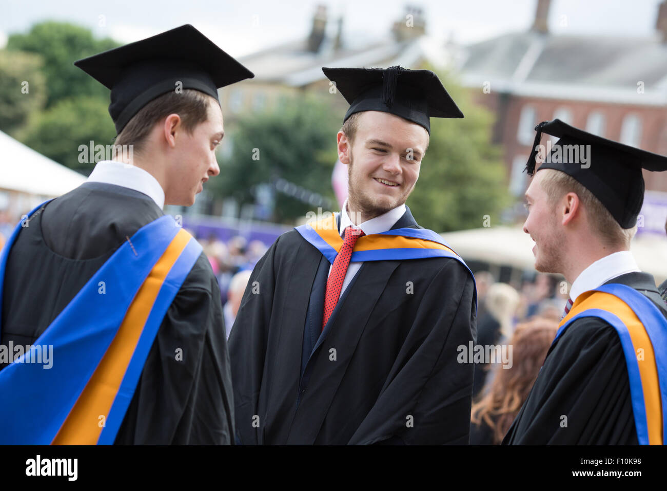 group of graduating university students after the ceremony in cap and ...