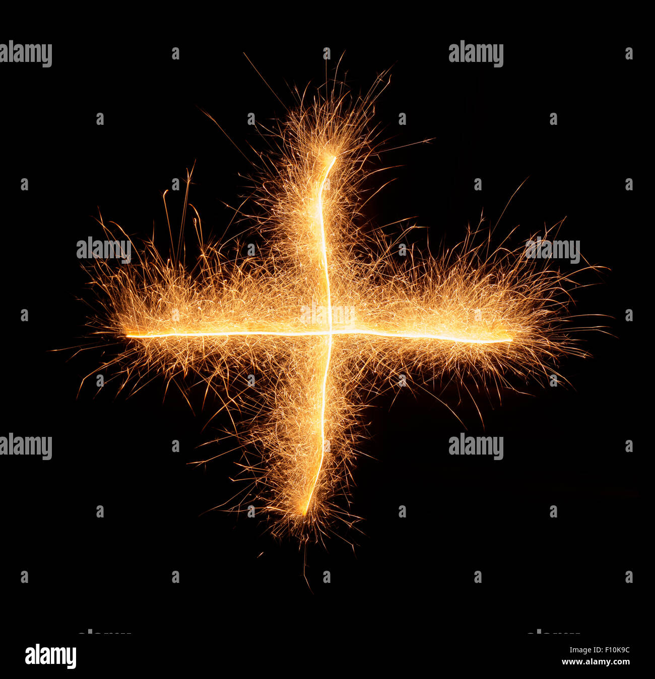 Plus symbol drawn with bengali sparkles isolated on black background ...