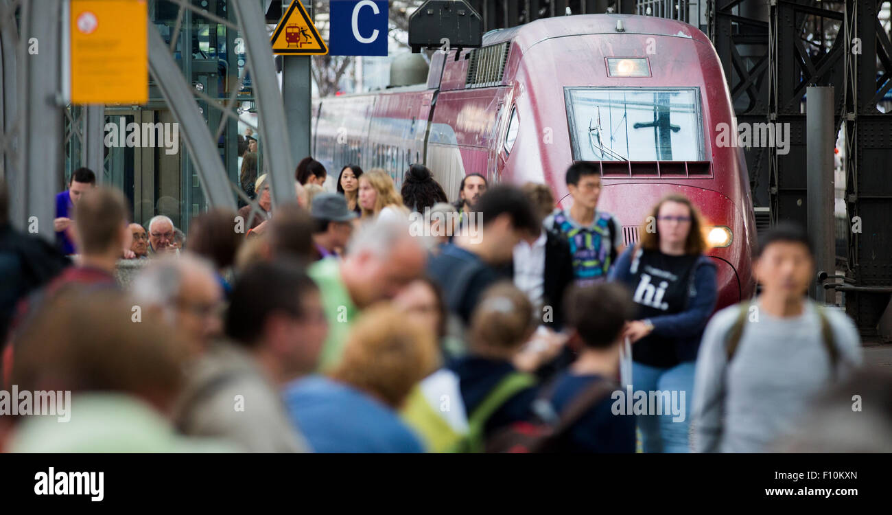 Cologne, Germany. 24th Aug, 2015. Passengers board the Thalys railway ...