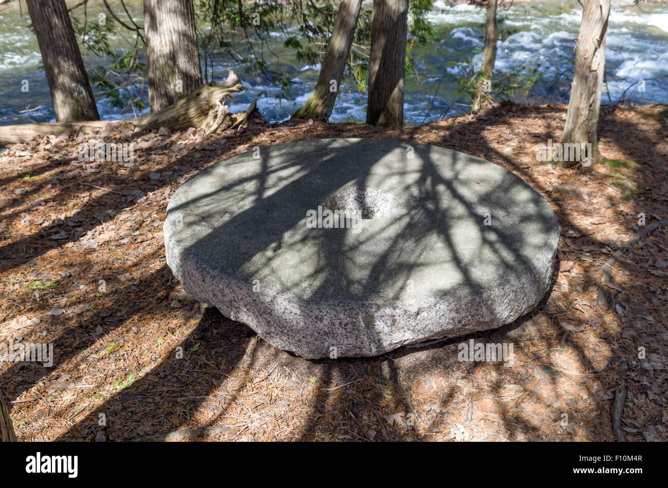 Parts of an old mill stone at Mill of Kintail Almonte Ontario Stock ...