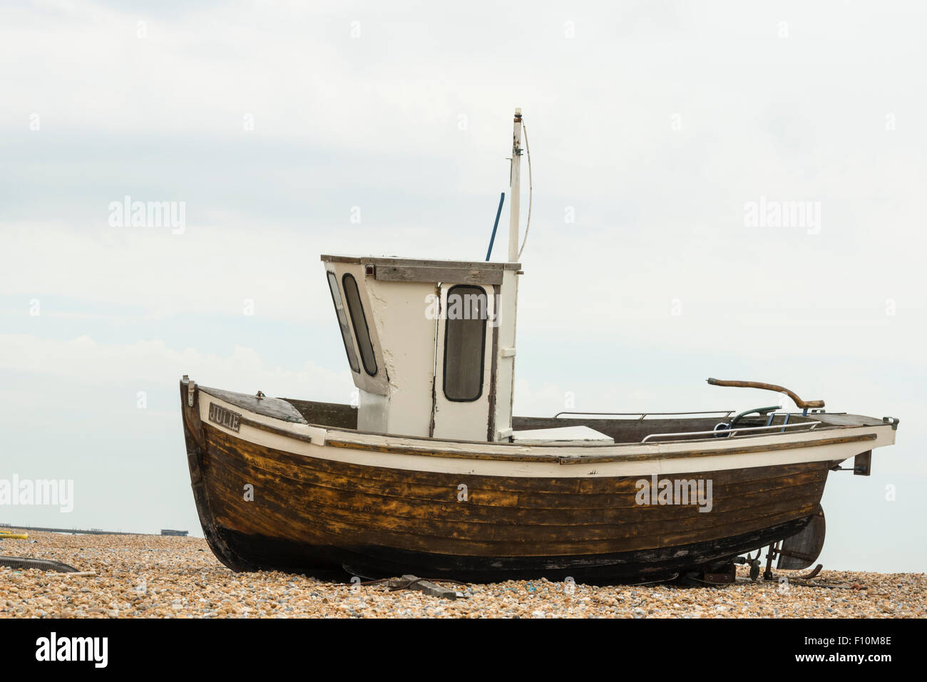 Side view of a fishing boat beached at Deal in Kent with the North Sea ...