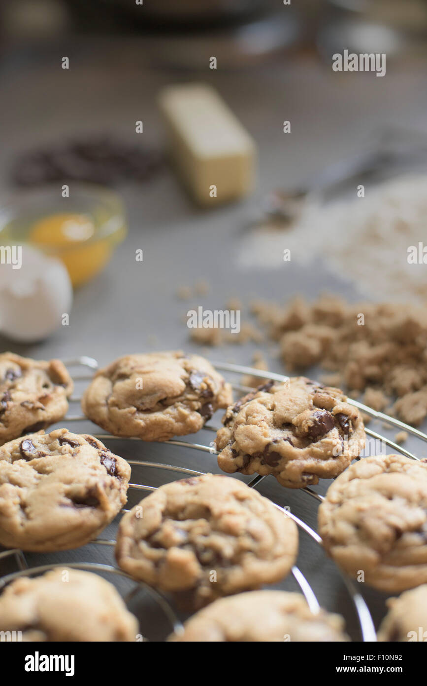 Chocolate chip cookies on cooling rack with ingredients Stock Photo - Alamy