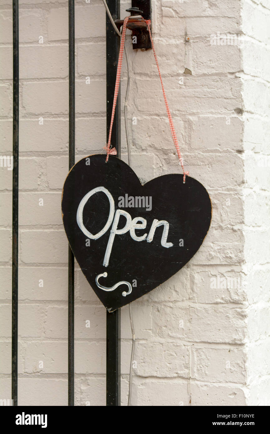 Open love heart sign outside shop in Bedford Bedfordshire England Stock ...
