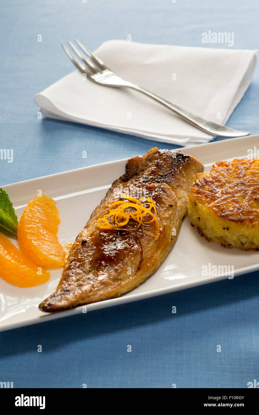 Spicy maple & orange mackerel with apple and potato rosti Stock Photo ...