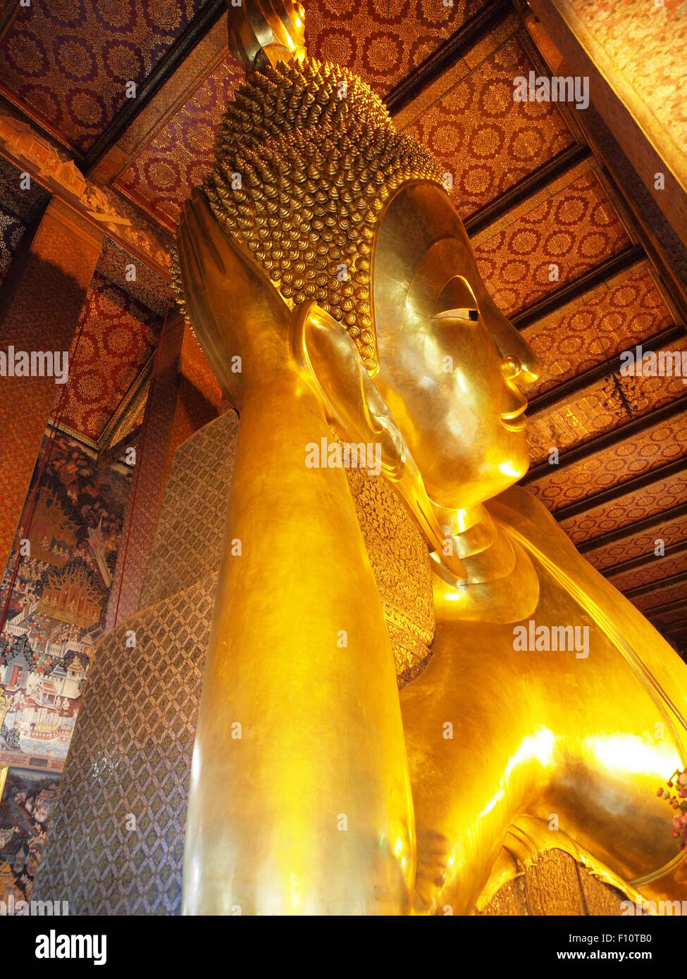 Laying golden buddha Stock Photo - Alamy