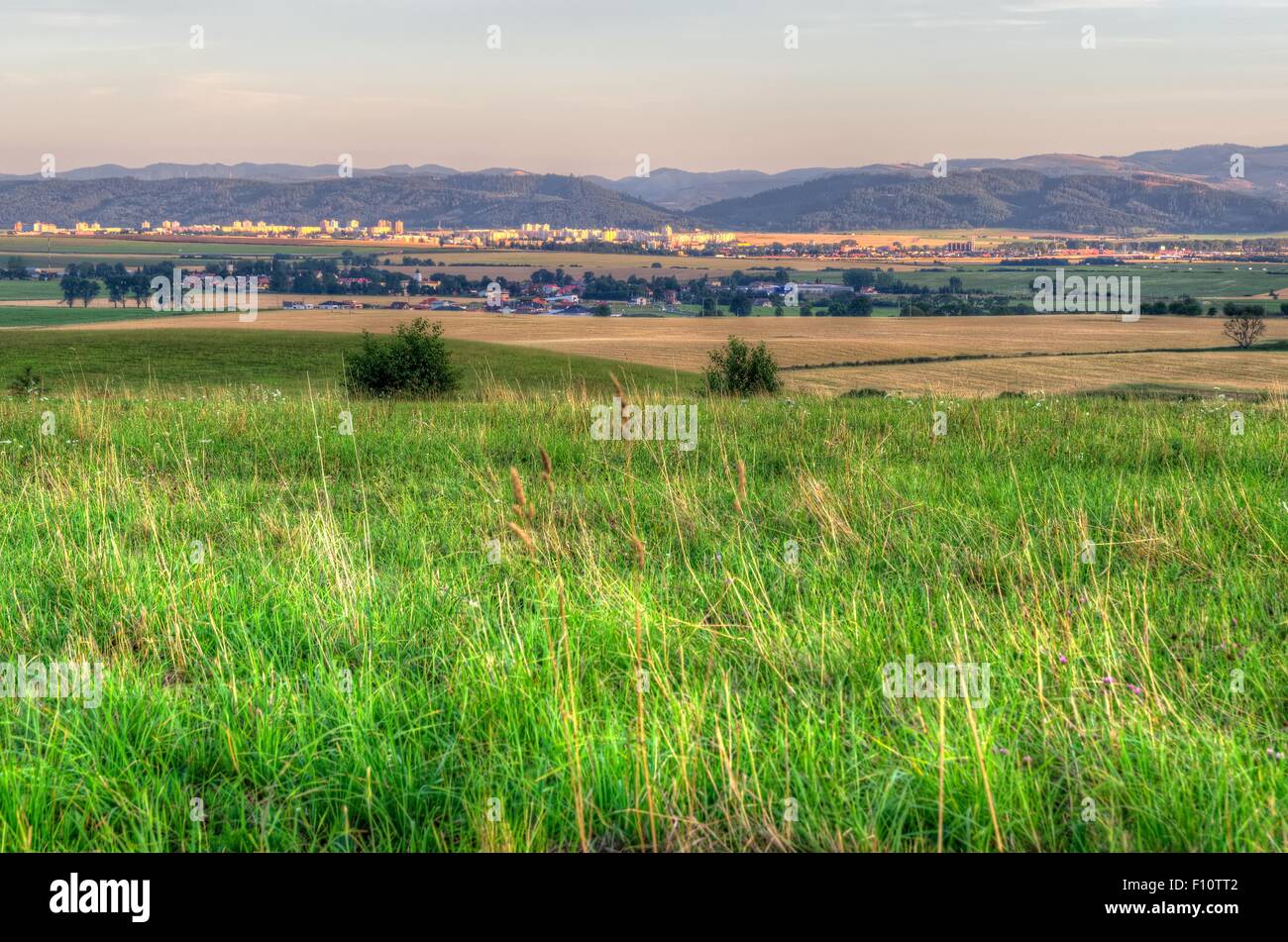 Rural summer landscape. Clearing and view on the Poprad City from the ...