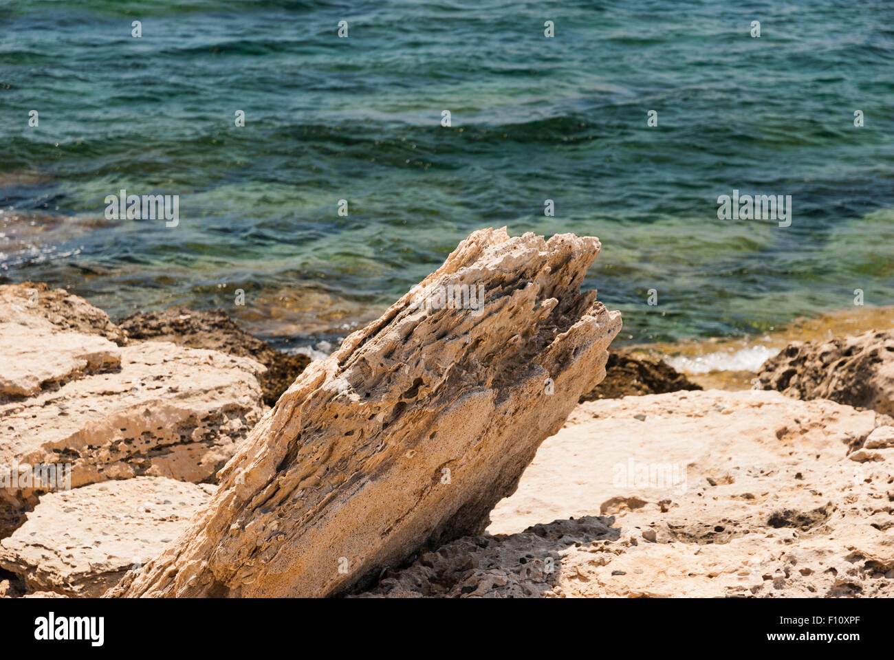 Sea rocks and the surface of sea water as a background Stock Photo - Alamy