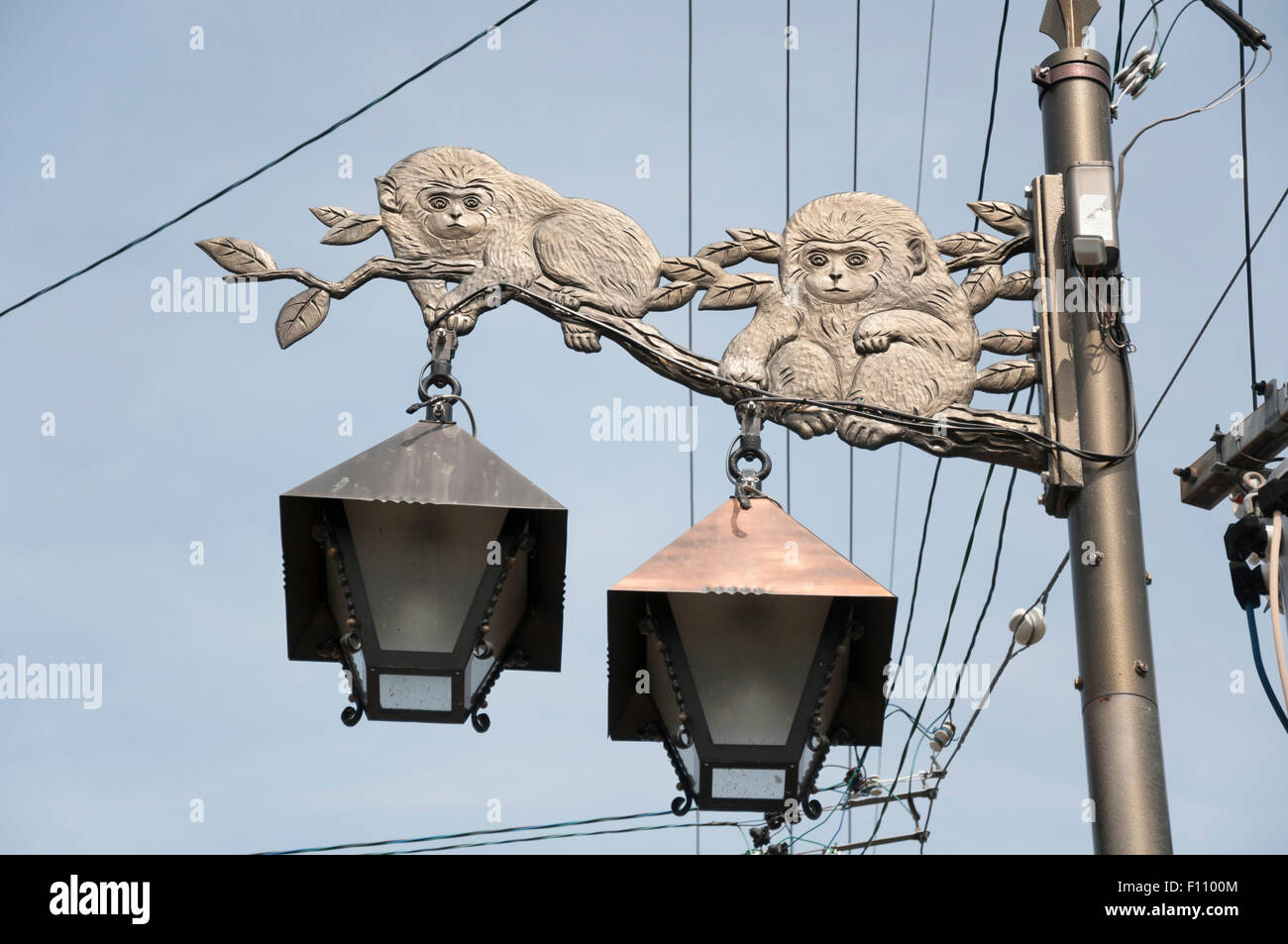 A street light stand with the addition of snow monkey figures, Yudanaka ...