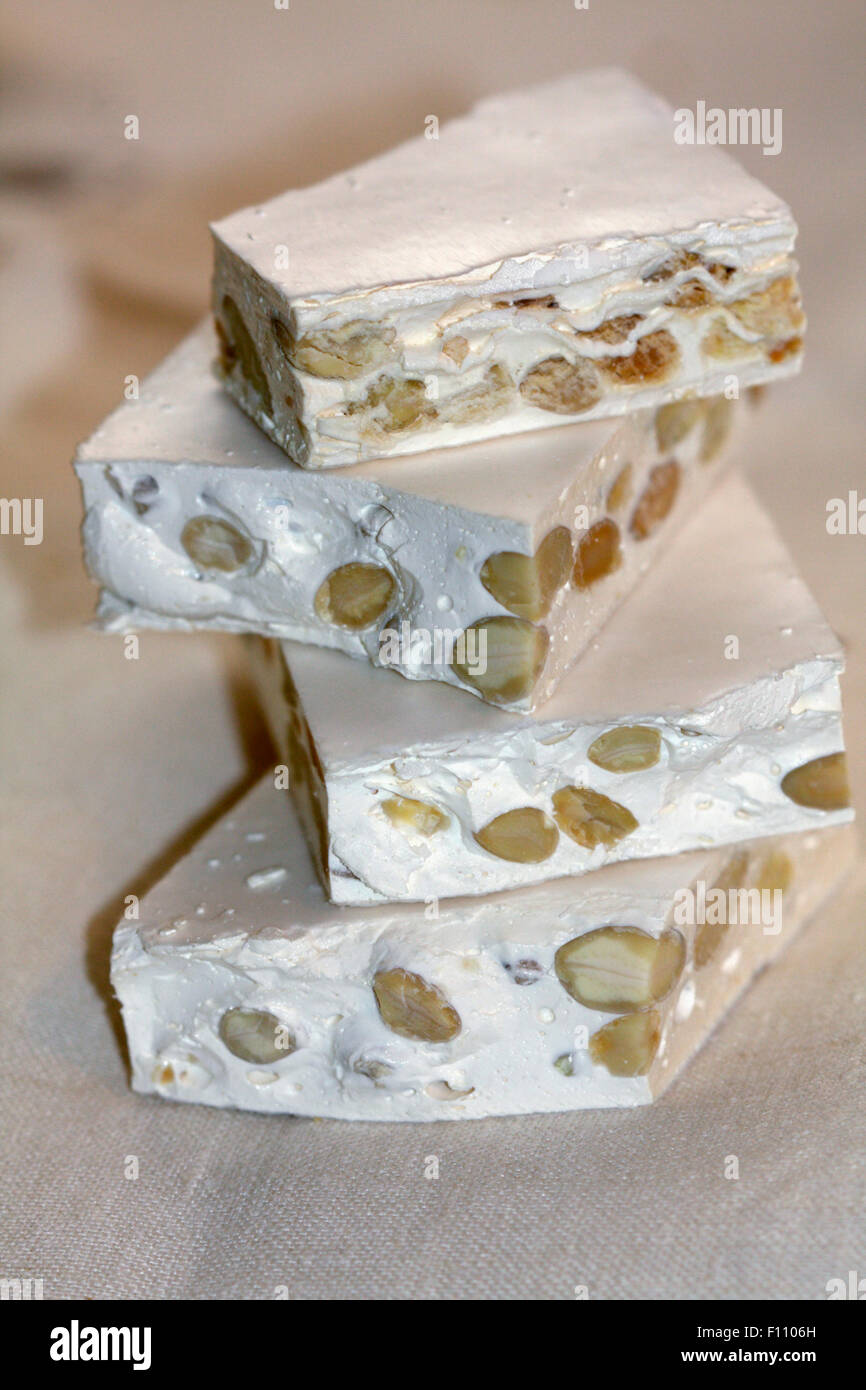 Traditional Italian torrone nougat with hazelnuts Stock Photo - Alamy