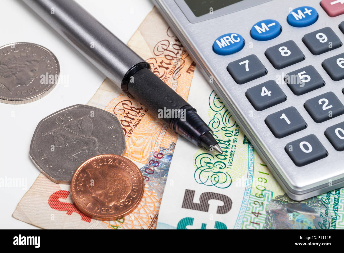 Pocket calculator and Pound money Stock Photo - Alamy