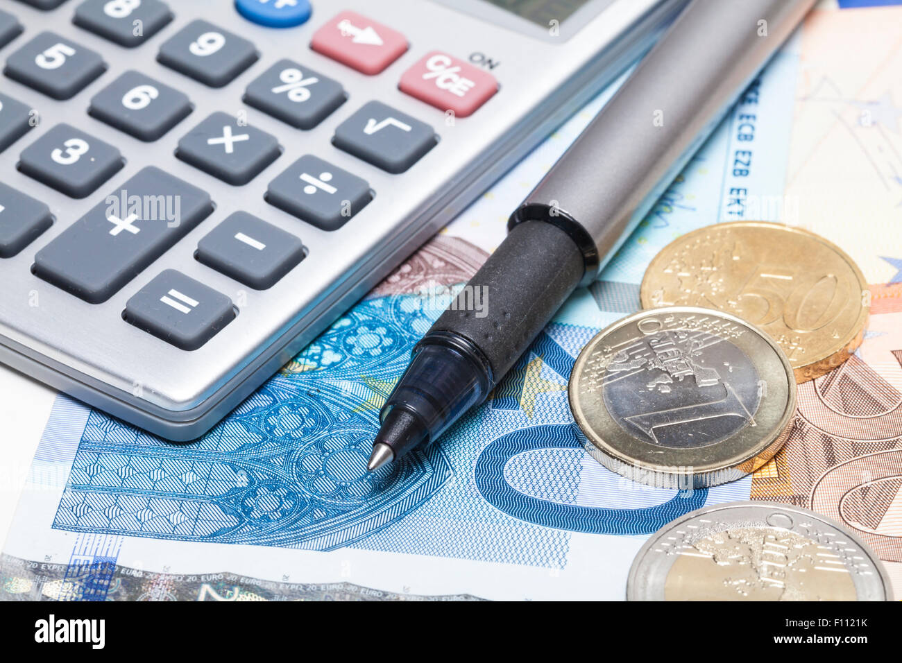Pocket calculator and Euro money Stock Photo - Alamy