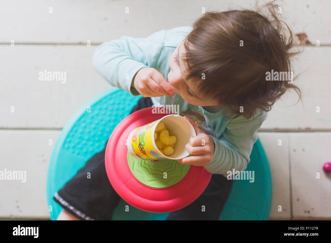 Toddler eating snack hi-res stock photography and images - Alamy