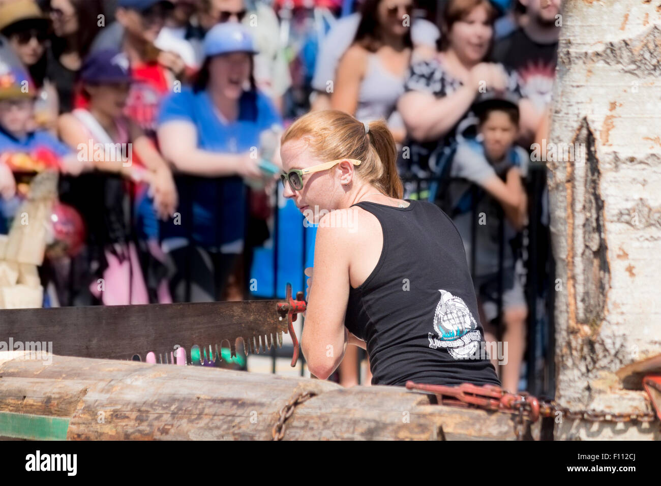 Female lumberjill competing in a lumberjack competition at the Canadian ...