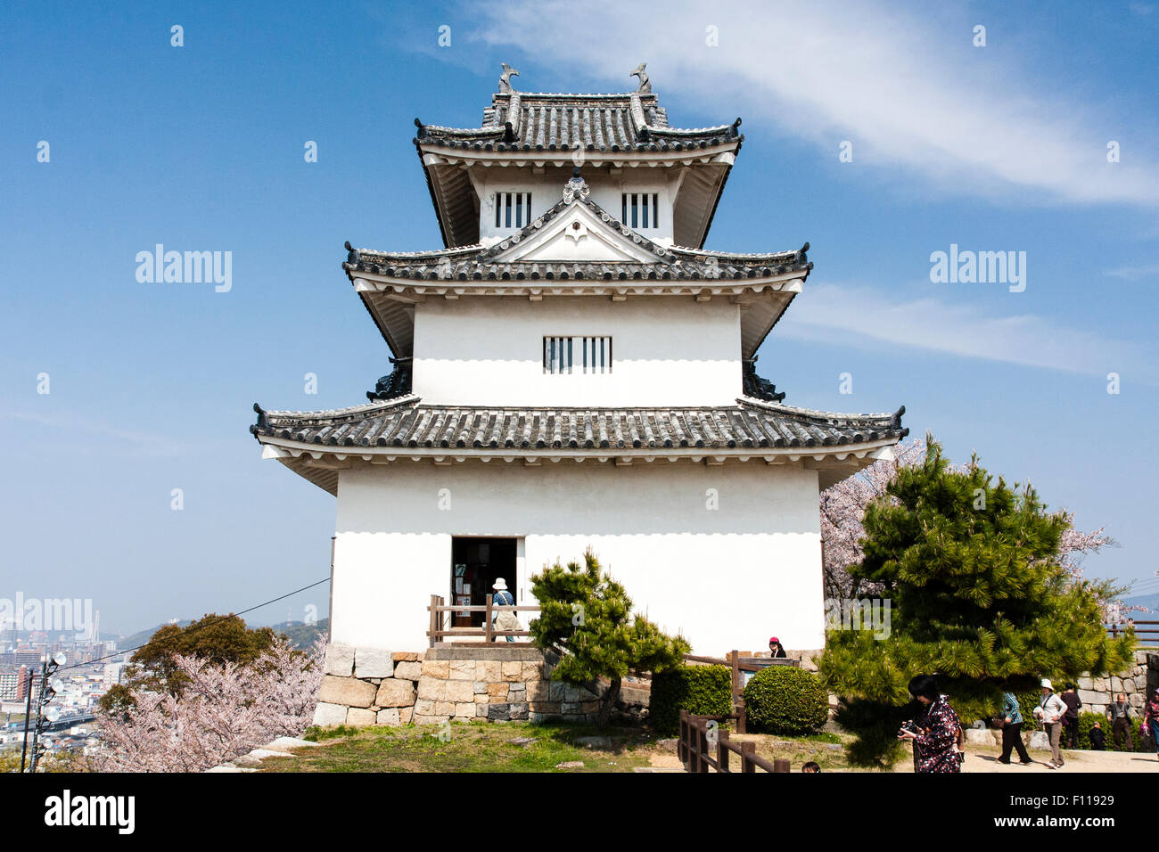 Castle keep at Marugame in Japan. Three story original hilltop sotogata ...