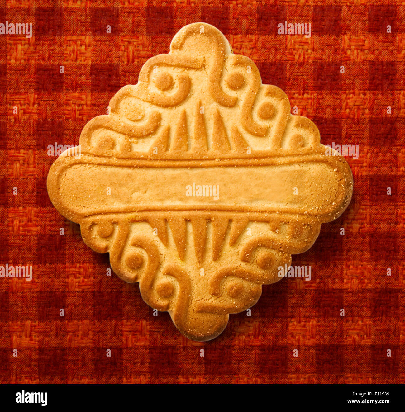 Single square biscuit in closeup as background Stock Photo - Alamy