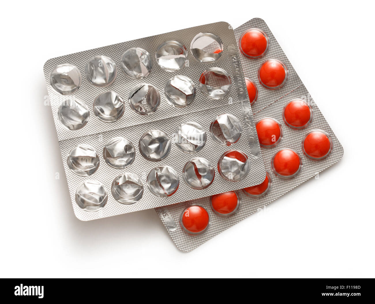 Colourful tablets in plastic packing on white Stock Photo - Alamy