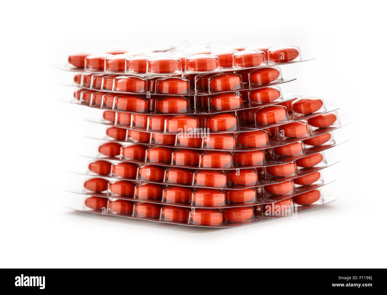 Colourful tablets in plastic packing on white Stock Photo - Alamy