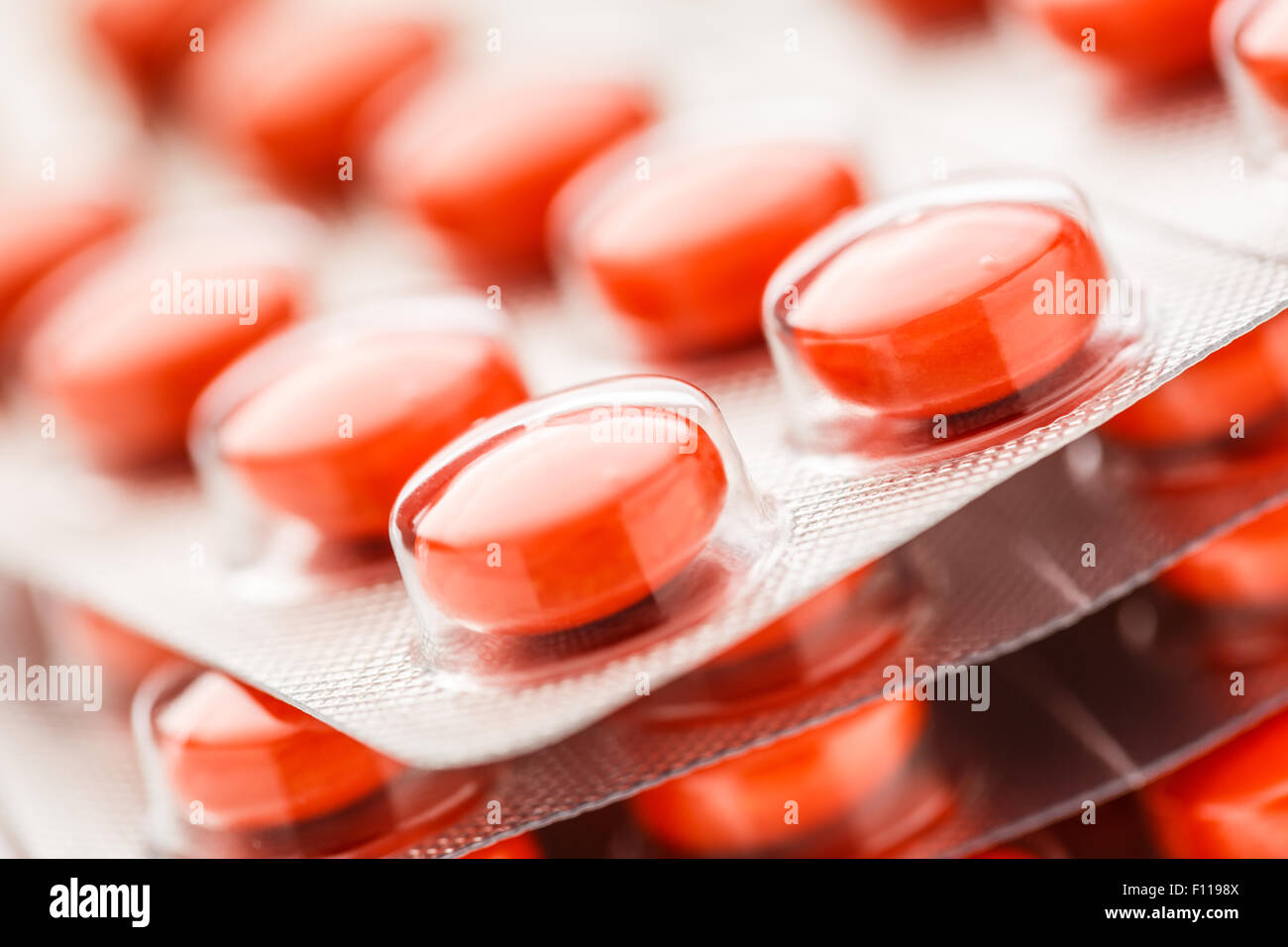 Colourful tablets in plastic packing as background Stock Photo - Alamy