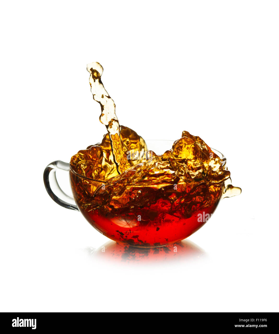 Glass cup of tea with splash Stock Photo - Alamy