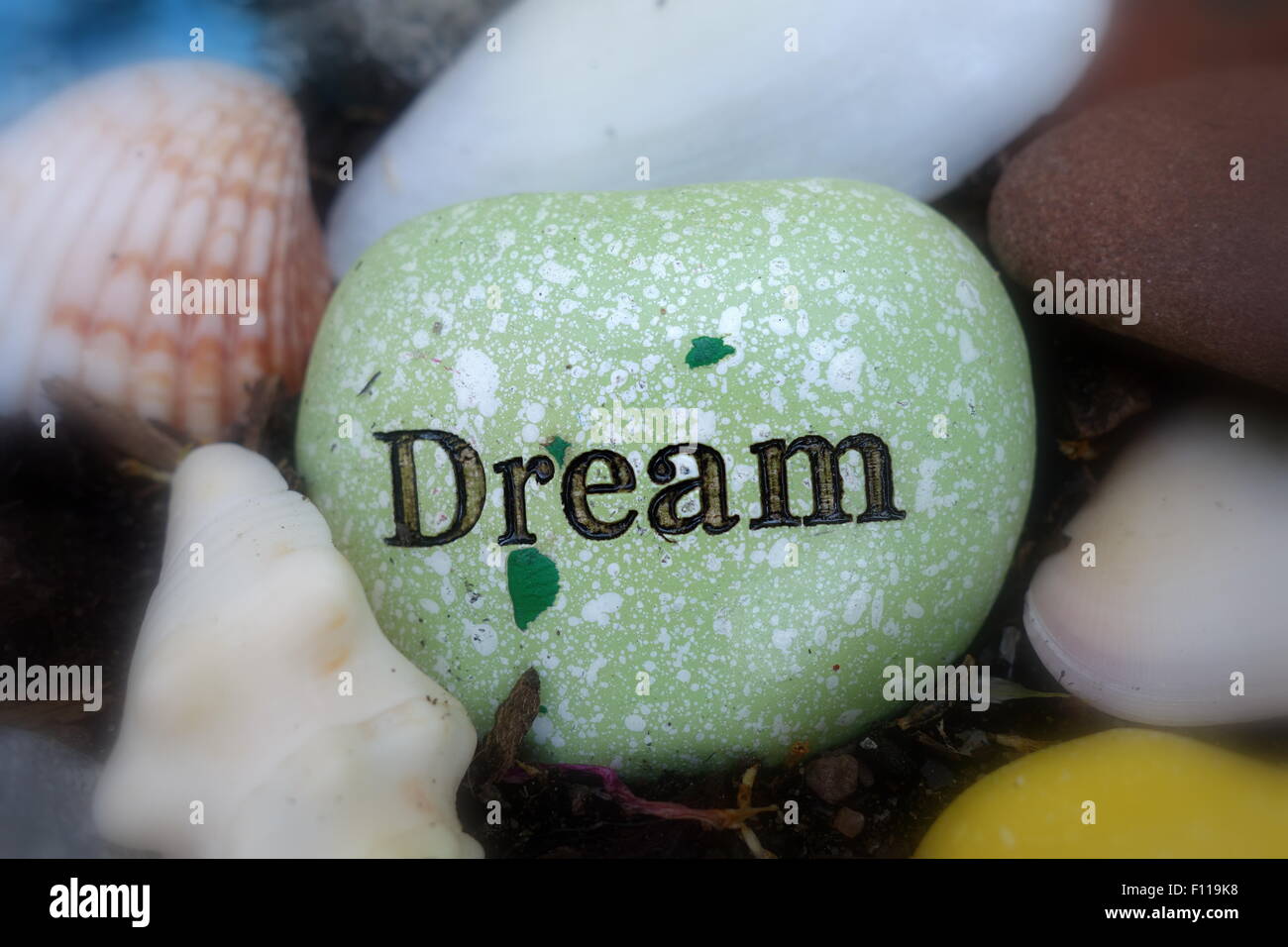 Inspirational quote on garden rock Stock Photo - Alamy