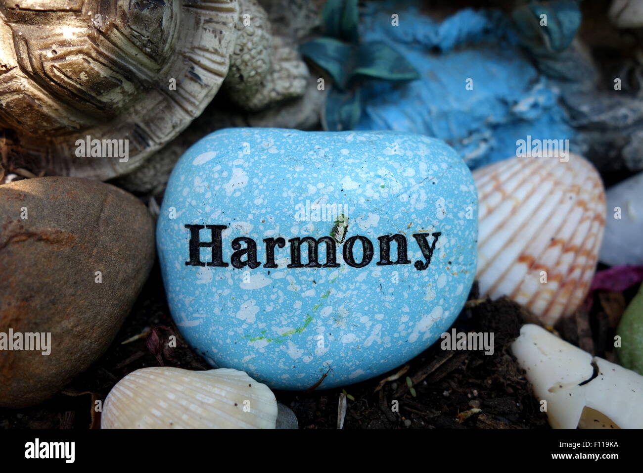 Inspirational quote on garden rock Stock Photo - Alamy