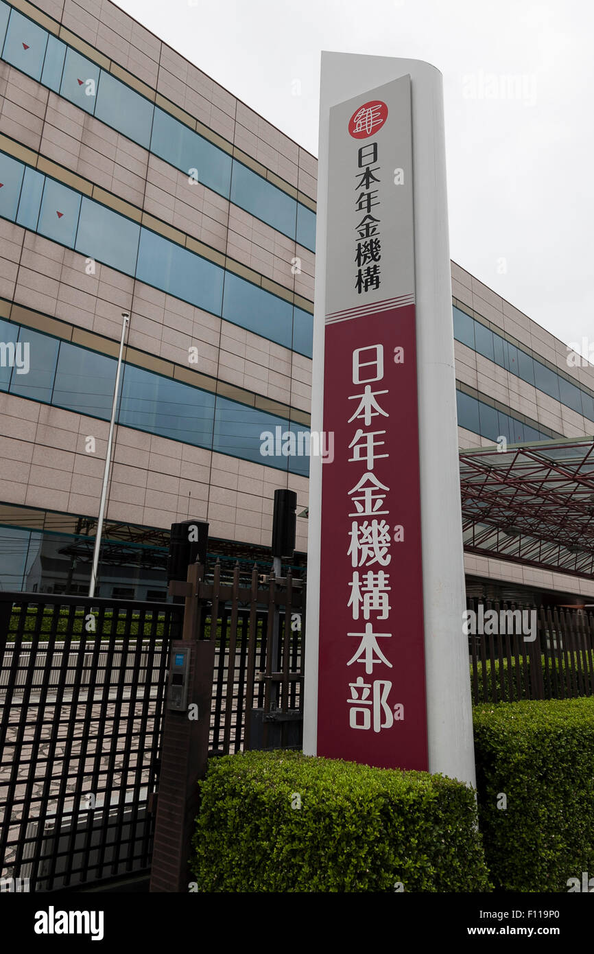 A sign of Japan Pension Service (JPS) on display outside the building ...