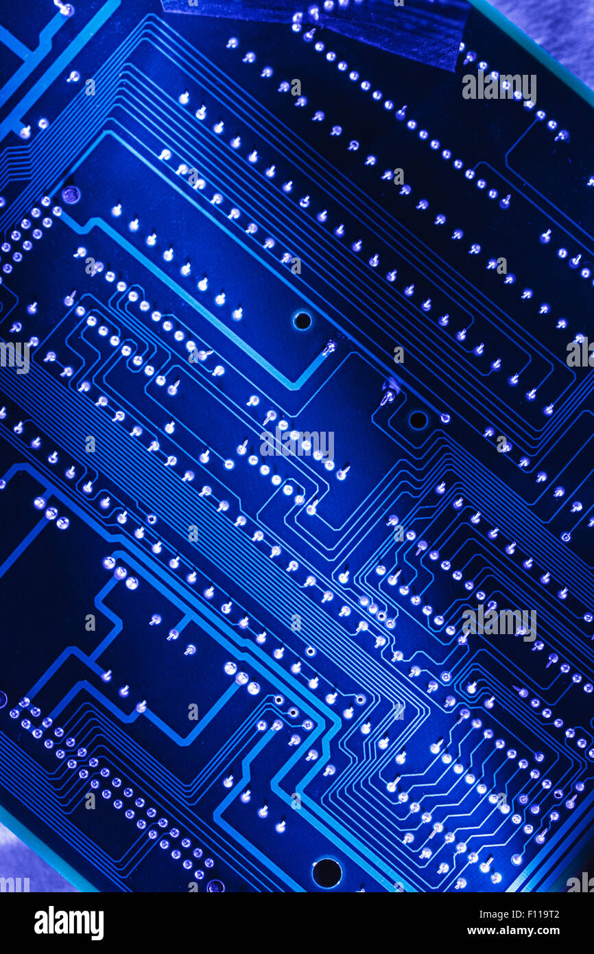 Computer board closeup in blue light toning Stock Photo - Alamy