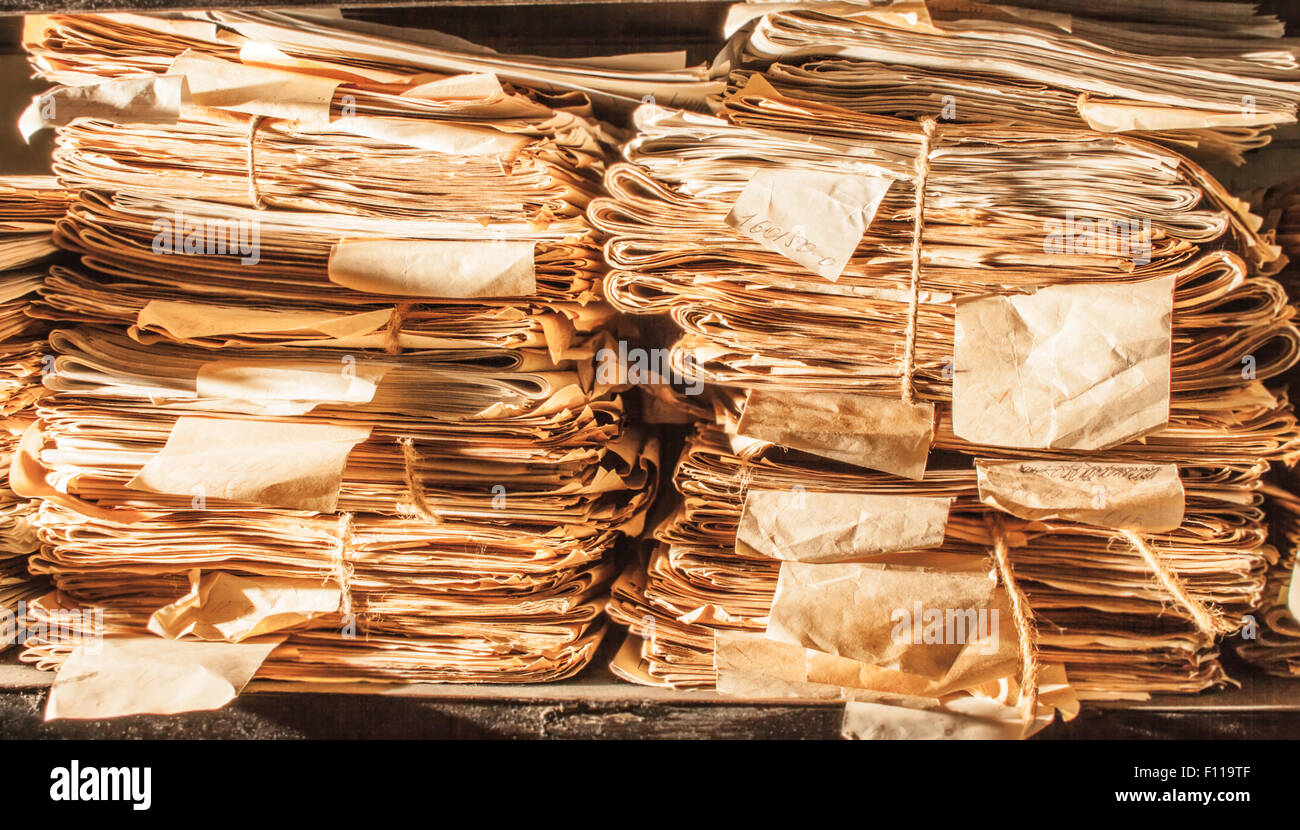 Paper documents stacked in archive in closeup Stock Photo - Alamy