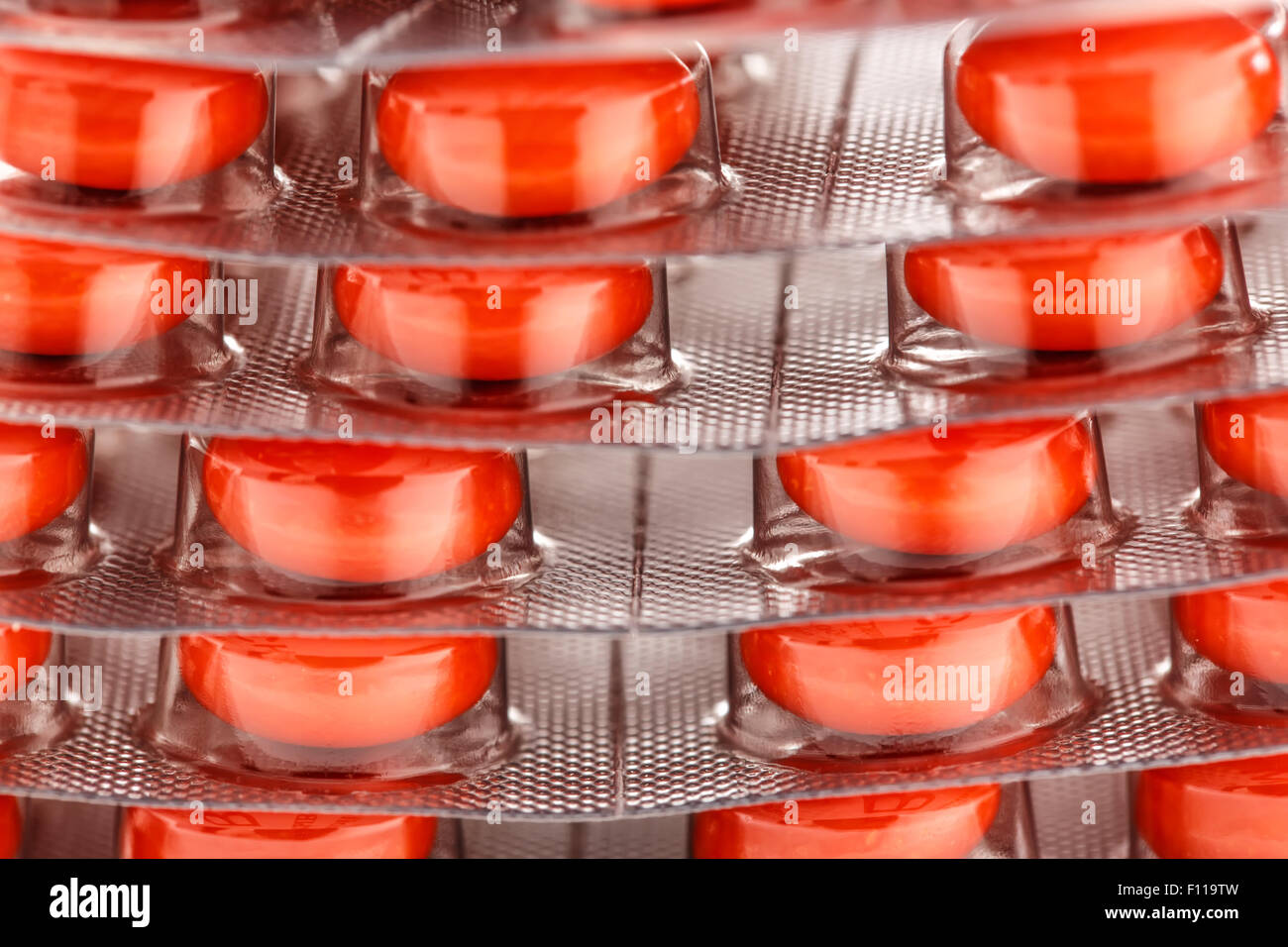 Colourful tablets in plastic packing as background Stock Photo - Alamy