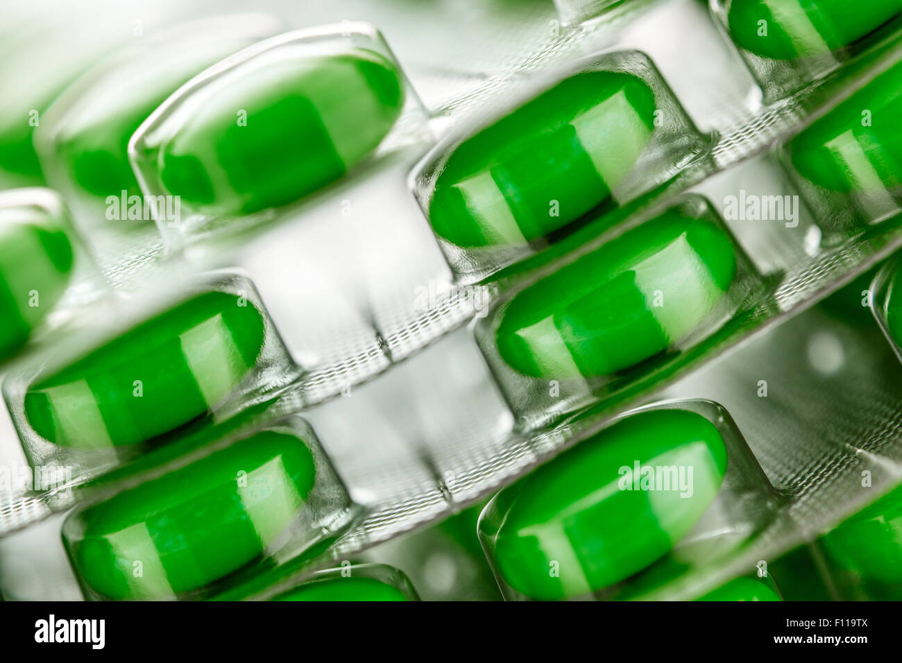 Colourful tablets in plastic packing as background Stock Photo - Alamy