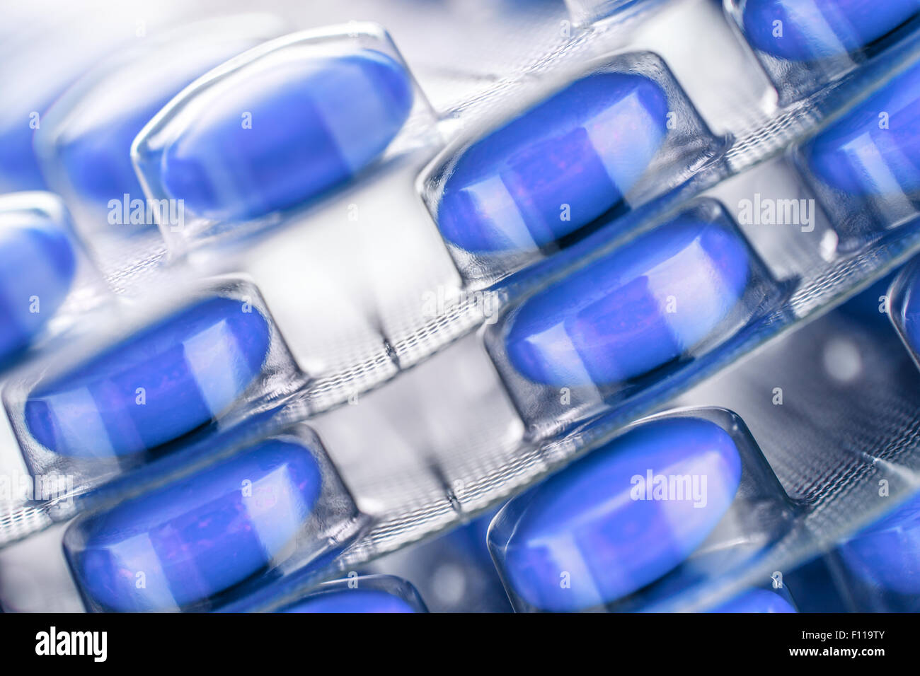 Colourful tablets in plastic packing as background Stock Photo - Alamy