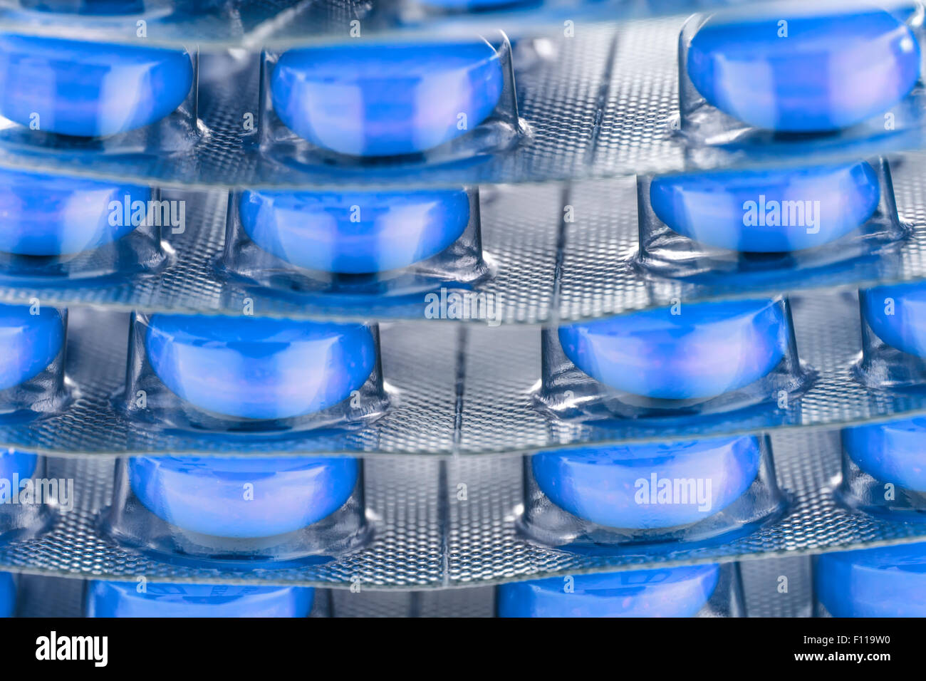 Colourful tablets in plastic packing as background Stock Photo - Alamy