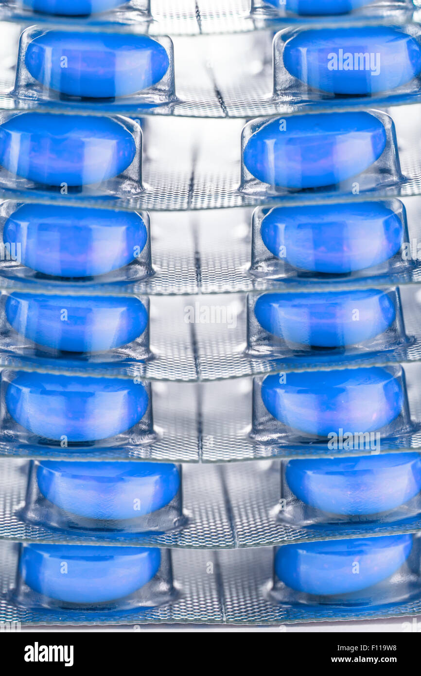 Colourful tablets in plastic packing as background Stock Photo - Alamy