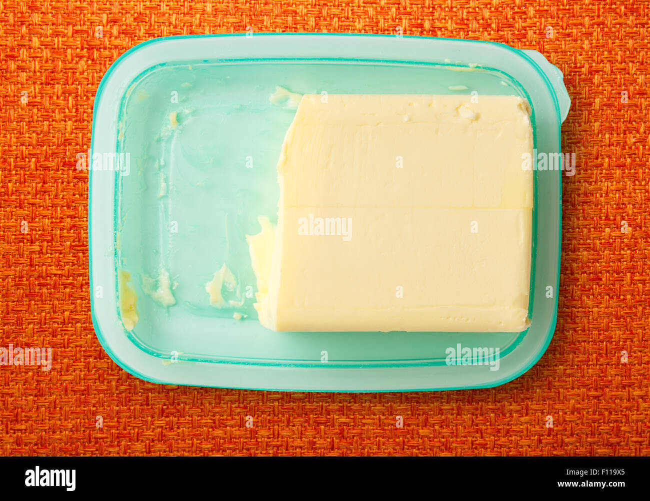 Fresh butter on the open green butterdish Stock Photo - Alamy