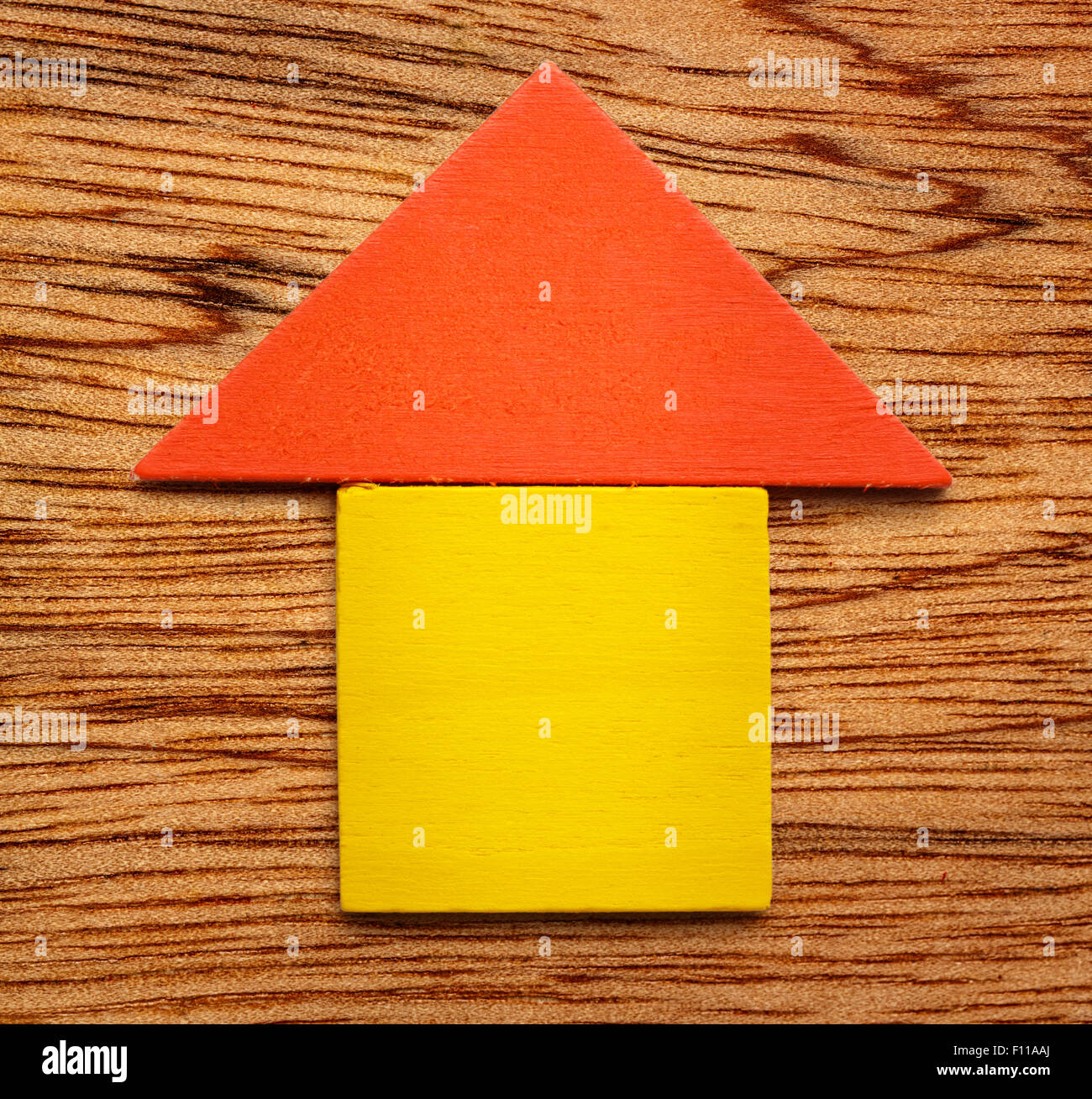 Little wooden house made of toy blocks Stock Photo - Alamy