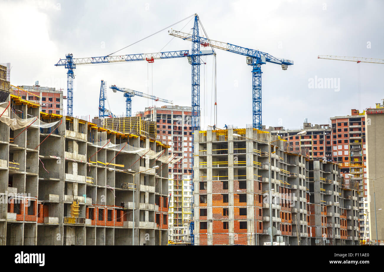 Many tall buildings under construction and cranes Stock Photo - Alamy