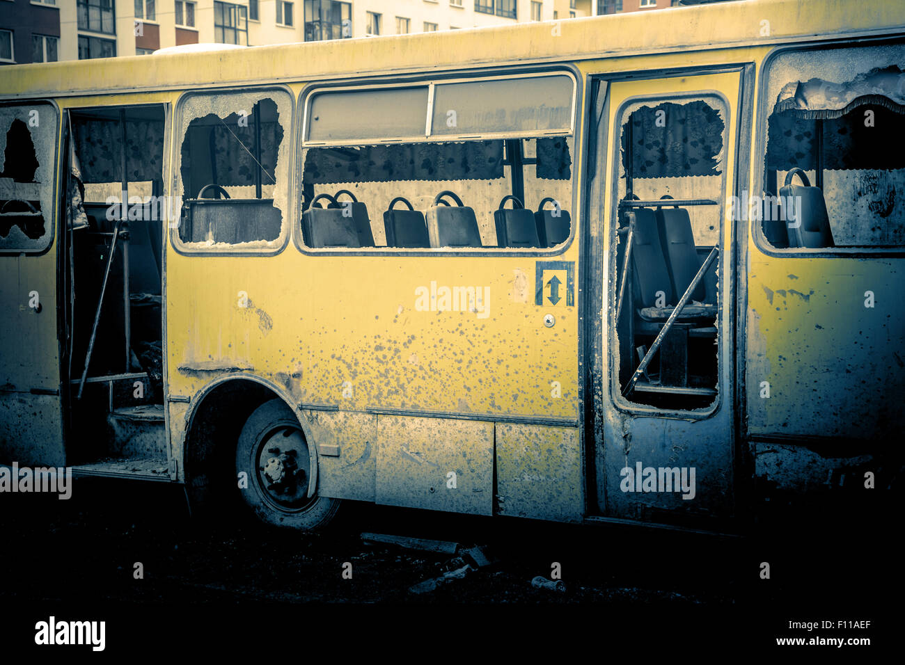Old dirty yellow bus with broken windows Stock Photo - Alamy