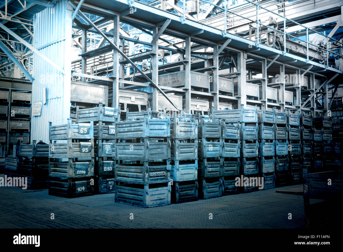 Big storage room with metal boxes in factory Stock Photo - Alamy