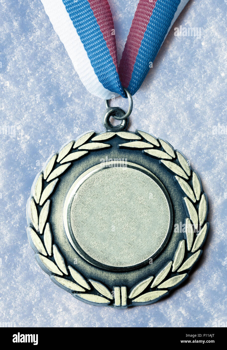 Metal medal with tricolor ribbon in closeup Stock Photo - Alamy