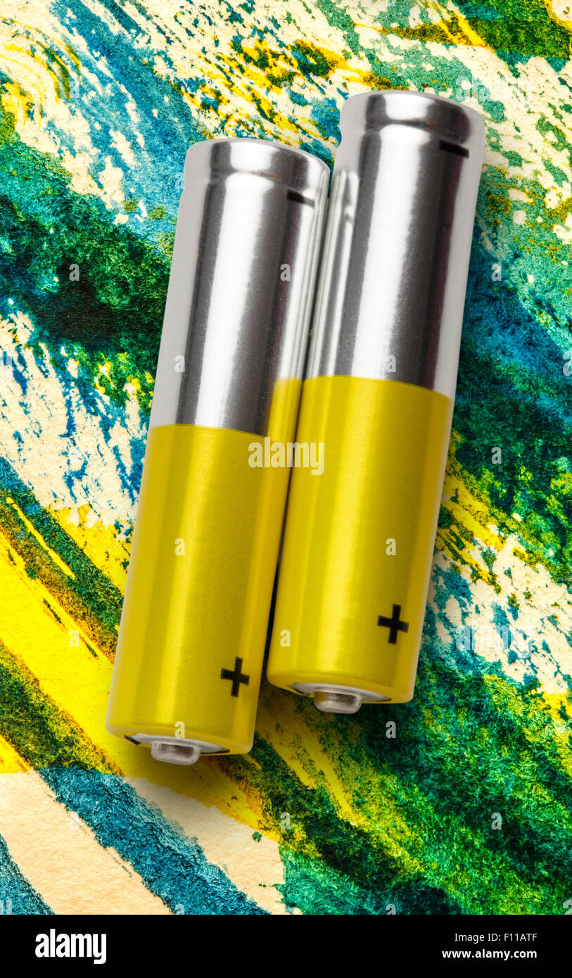 Two batteries with plus sign visible in closeup Stock Photo - Alamy