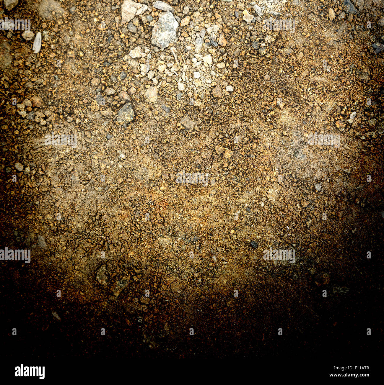 Brown ground surface as background in closeup Stock Photo - Alamy