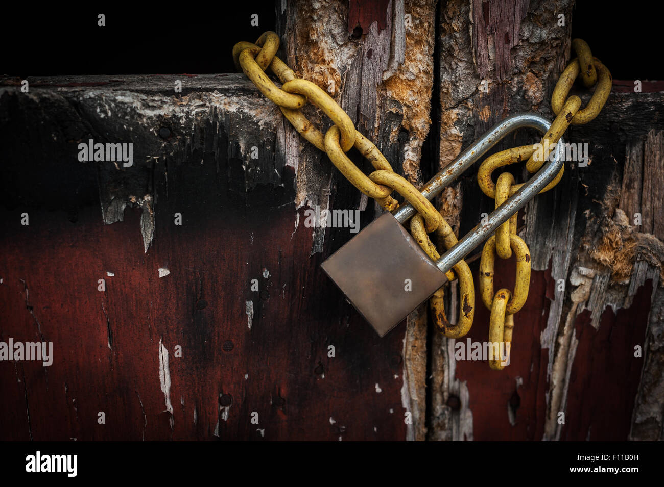 Old master key on old wooden door and shadow background, Selective ...
