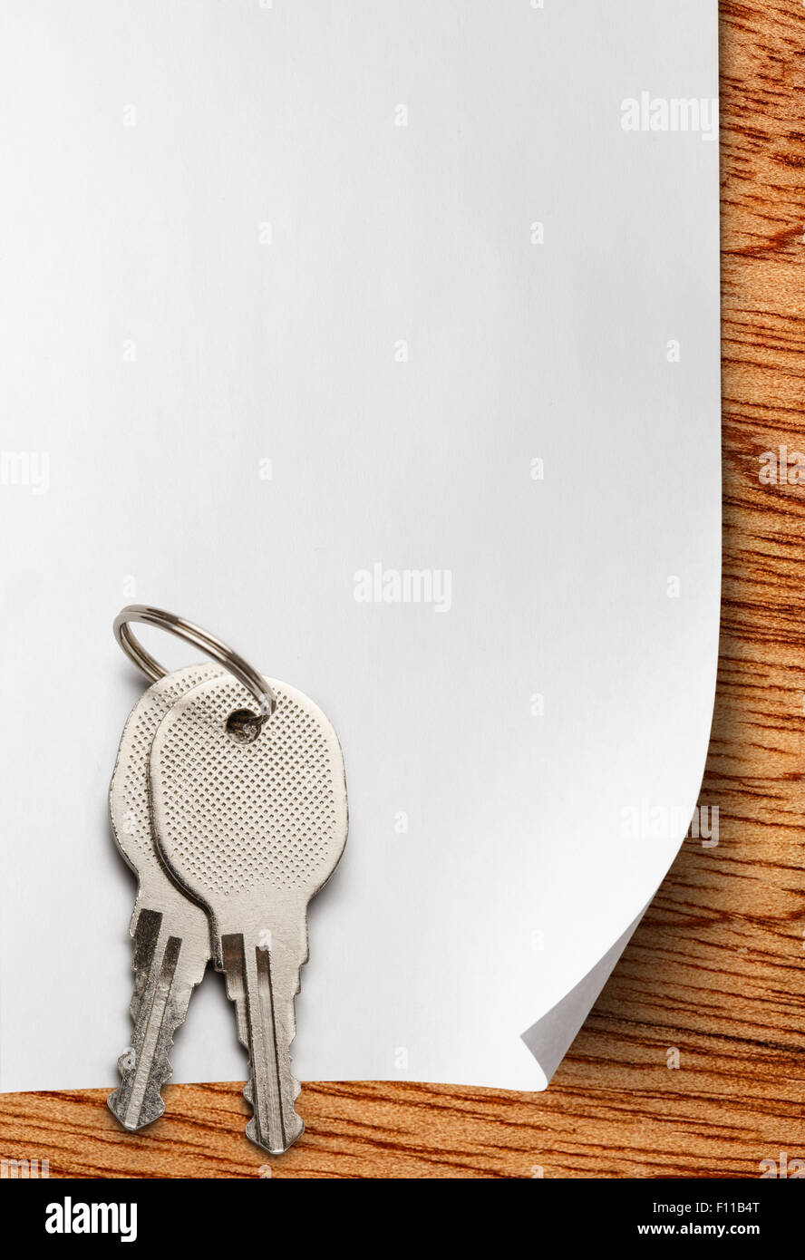 Blank sheet of paper with iron keys Stock Photo - Alamy