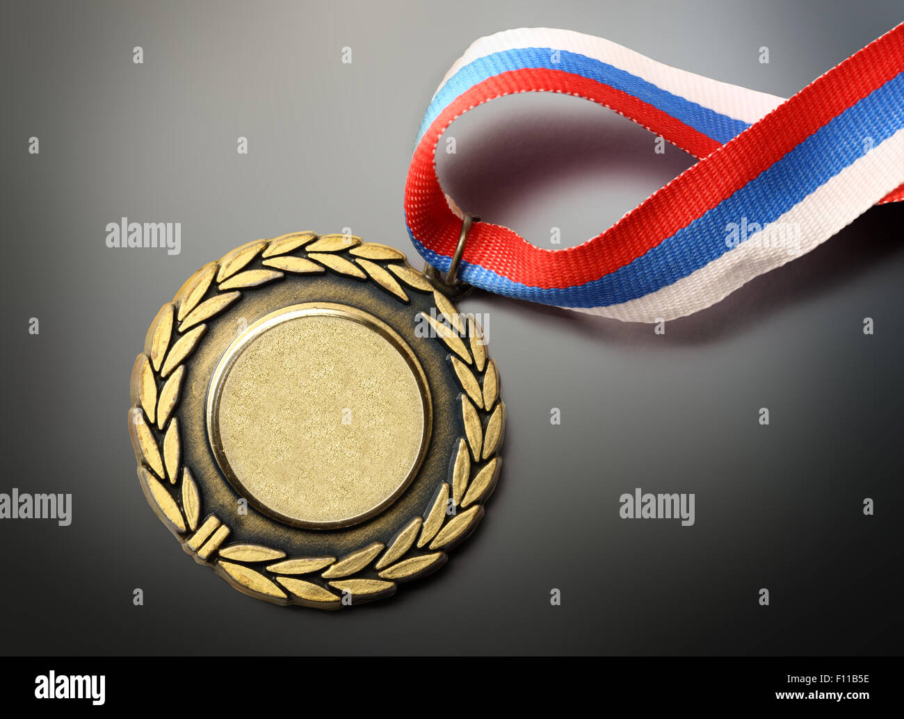 Metal medal with tricolor ribbon in closeup Stock Photo - Alamy