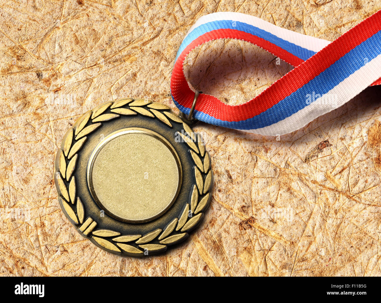 Metal medal with tricolor ribbon in closeup Stock Photo - Alamy