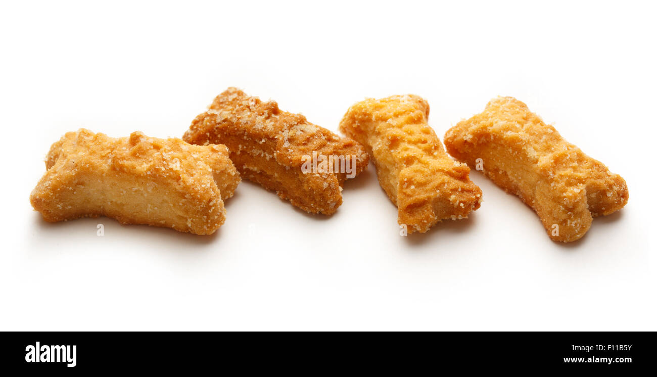 Pile of bone formed cookies on white background Stock Photo - Alamy