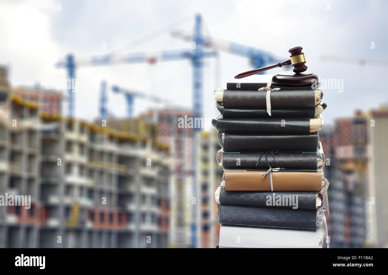 Document files with gavel on buildings under construction Stock Photo ...