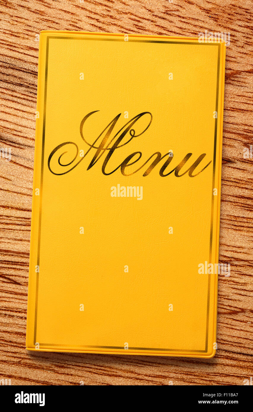 The yellow framed menu book in closeup Stock Photo - Alamy