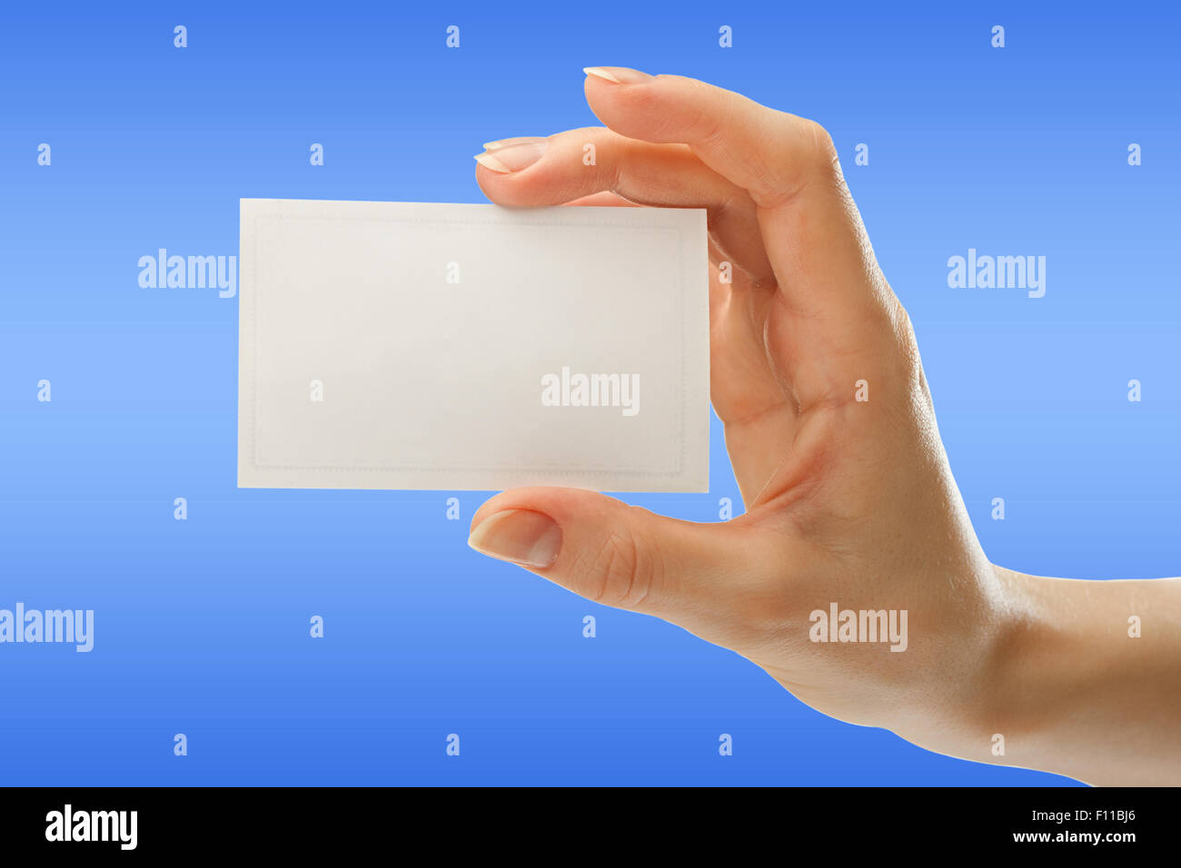 Blank card in female hand in closeup Stock Photo - Alamy